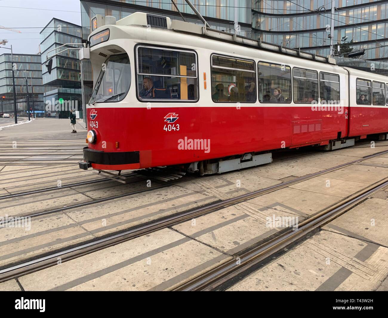 red Tram is running on the road. Trams in Vienna Stock Photo - Alamy