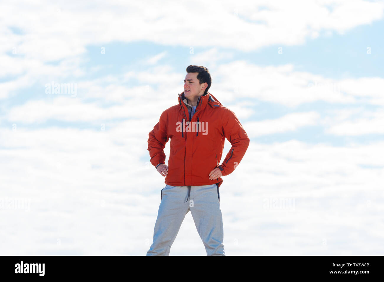 Bodybuilder performing his stretching routine in the morning on an ...