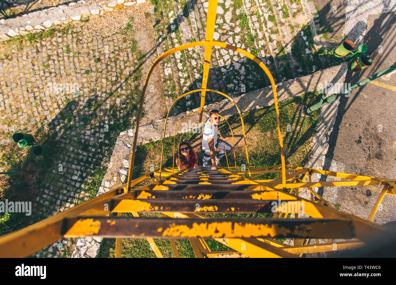 Boy girl trying climb hi-res stock photography and images - Alamy
