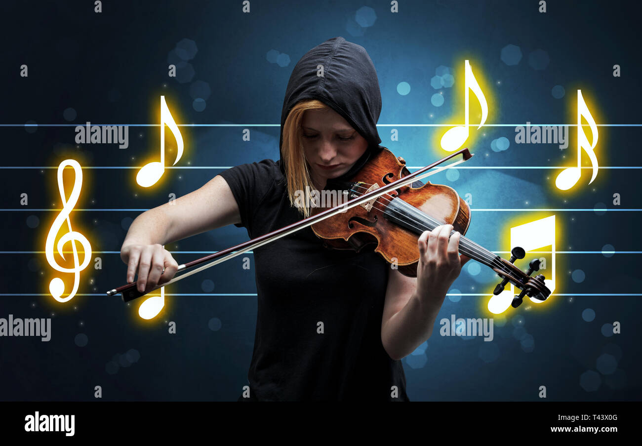 Young handsome fiddler playing with music sheet background Stock Photo ...