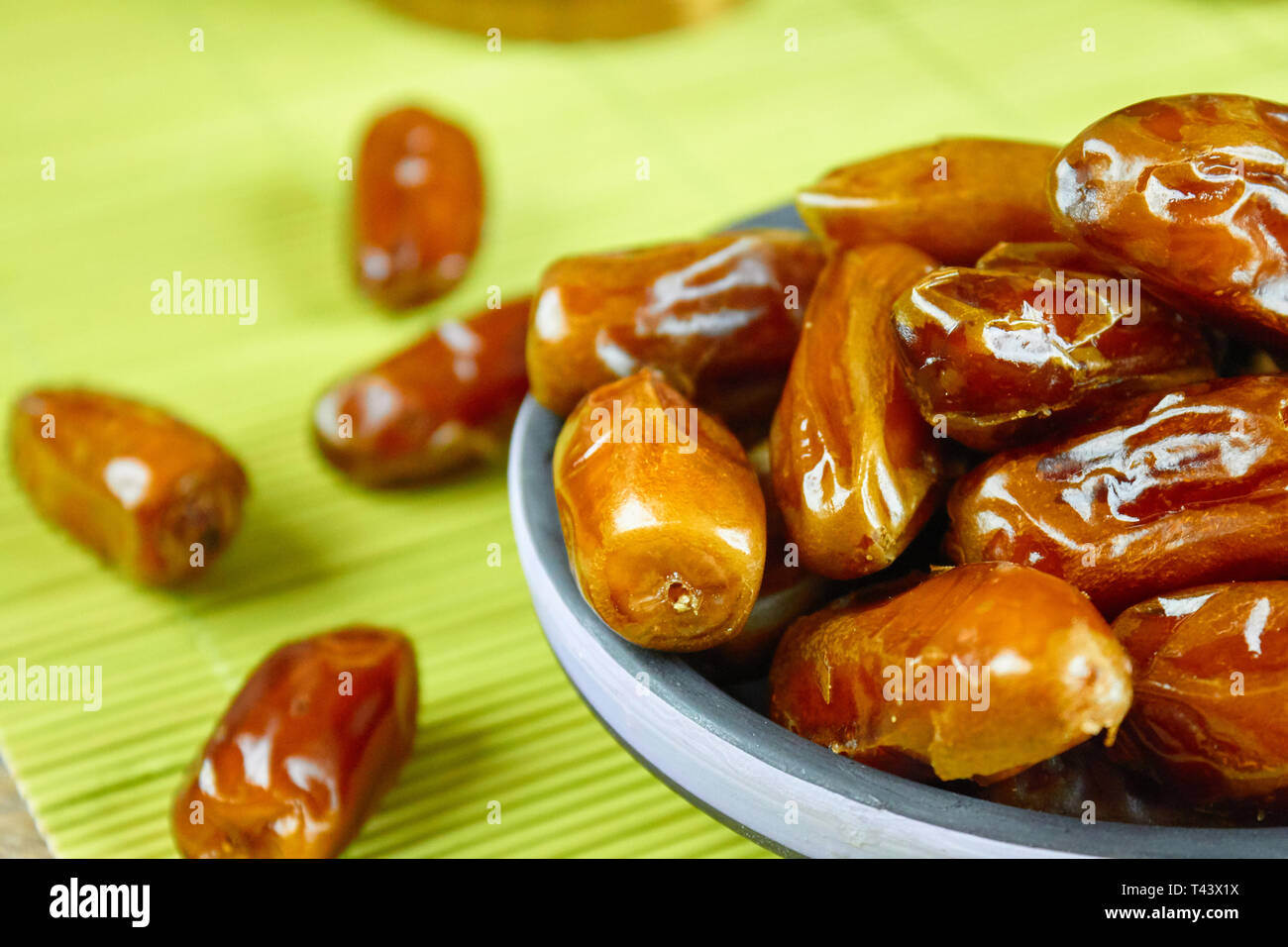 Sweet arabic algerian dates fruits on a ceramic plate Stock Photo - Alamy