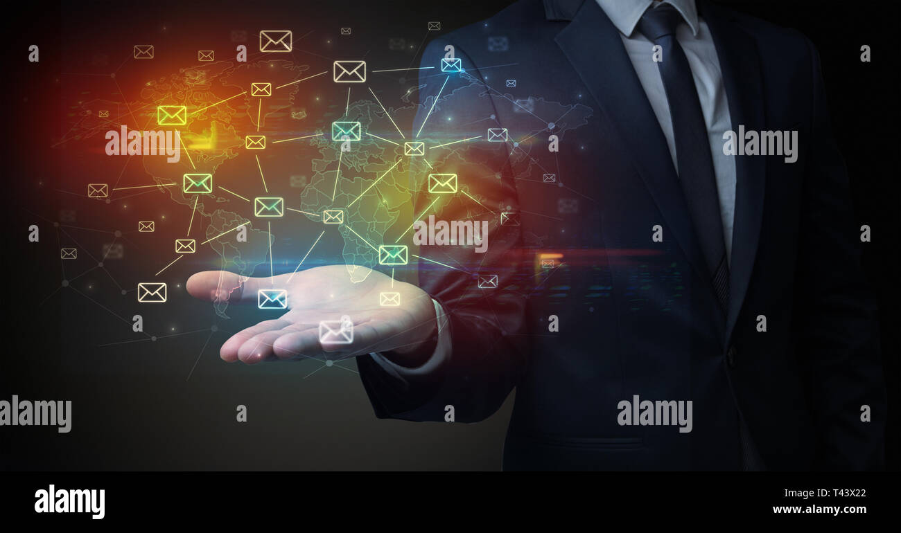 Elegant businessman holding communication concept on his hand Stock ...