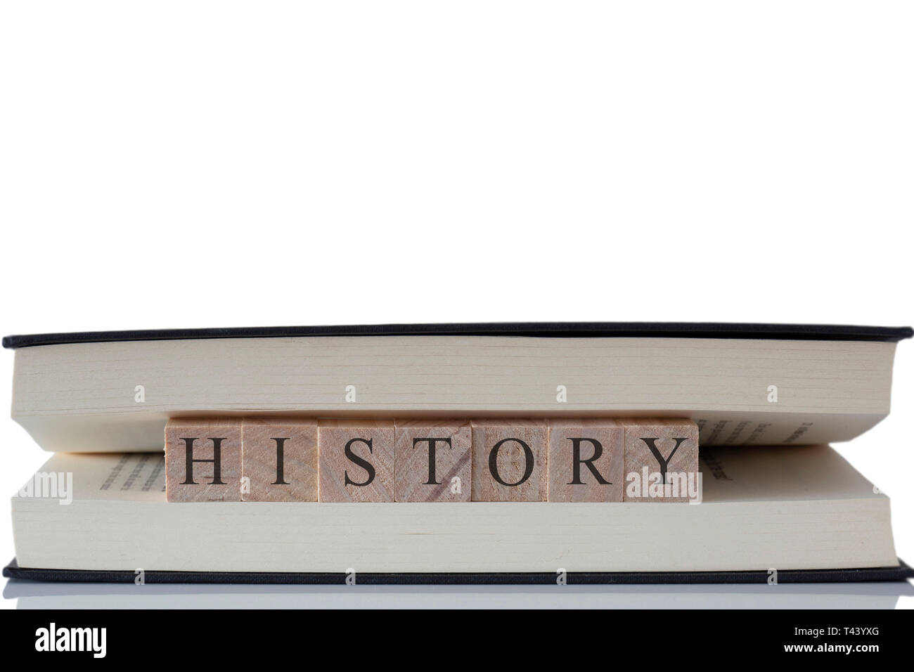 History written on wooden blocks inside a book isolated on a white ...
