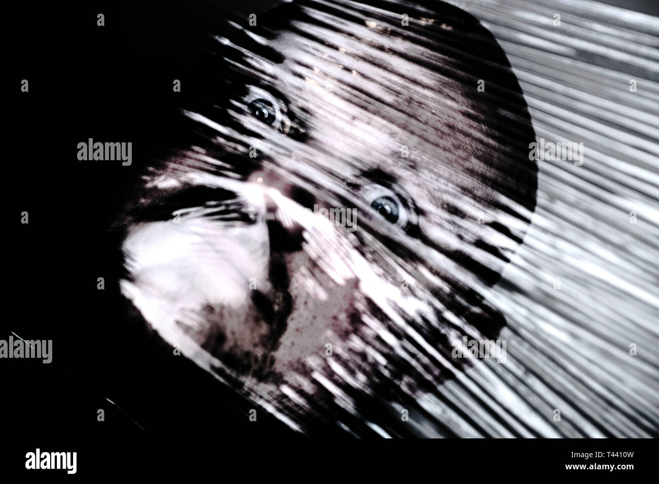 Scary men's face in cling film Stock Photo - Alamy