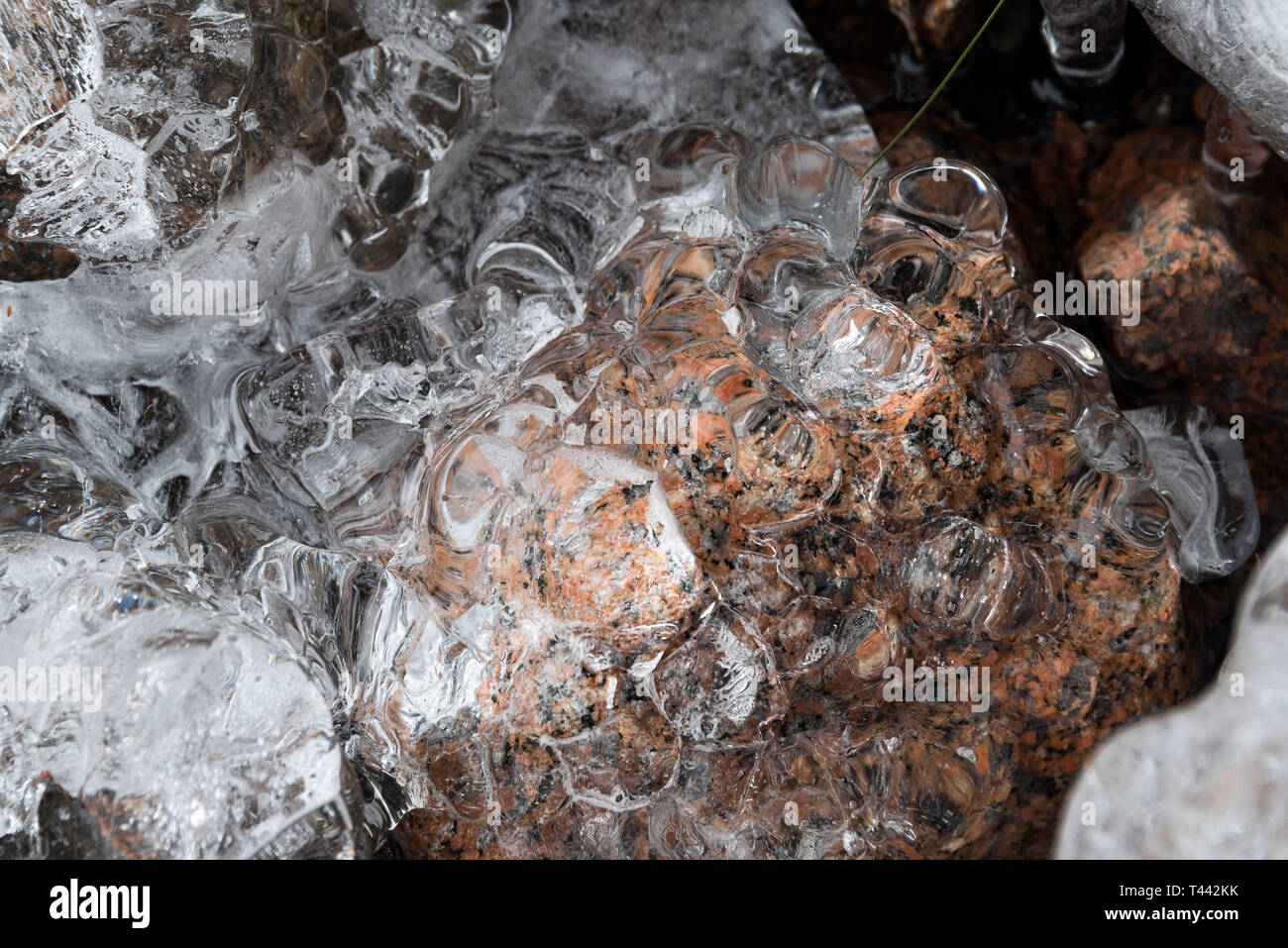 Unusual ice formations below dripping icicles Stock Photo - Alamy