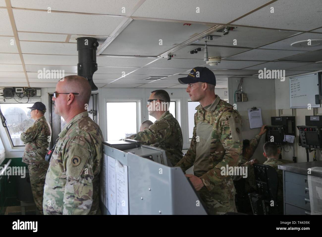 Crew members aboard the U.S. Army’s Logistics Support Vessel Maj. Gen ...