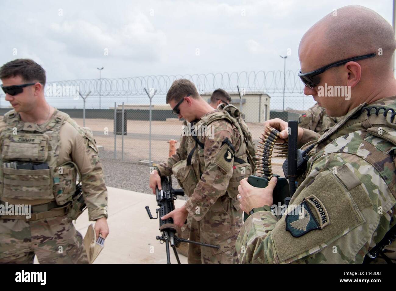 U.S. Army Staff Sgt. Tyler Wisely, right, assigned to the East Africa ...