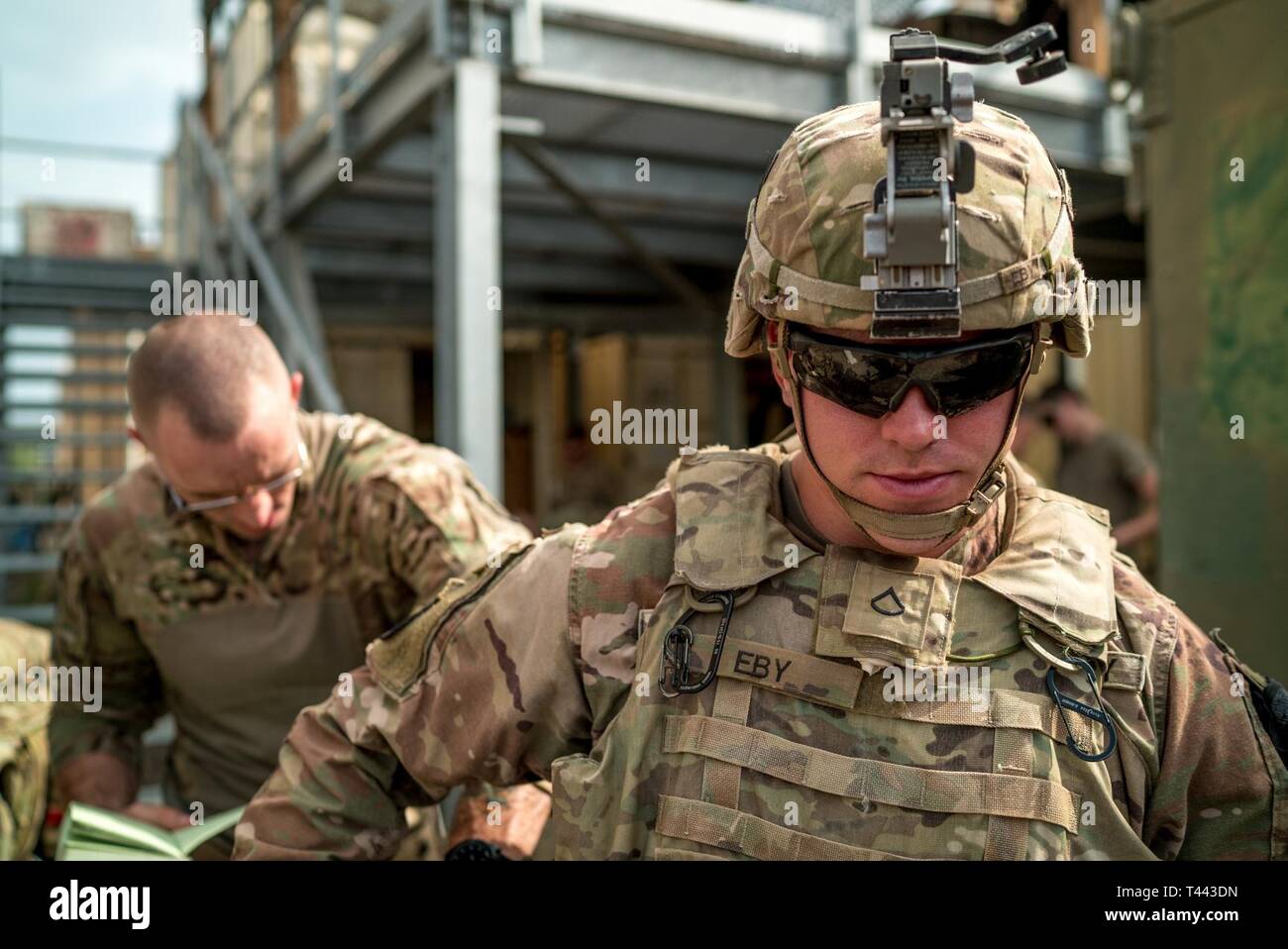 U.S. Army Sgt. Royce Fletcher, left, and Pfc. Eric Eby, right, assigned ...