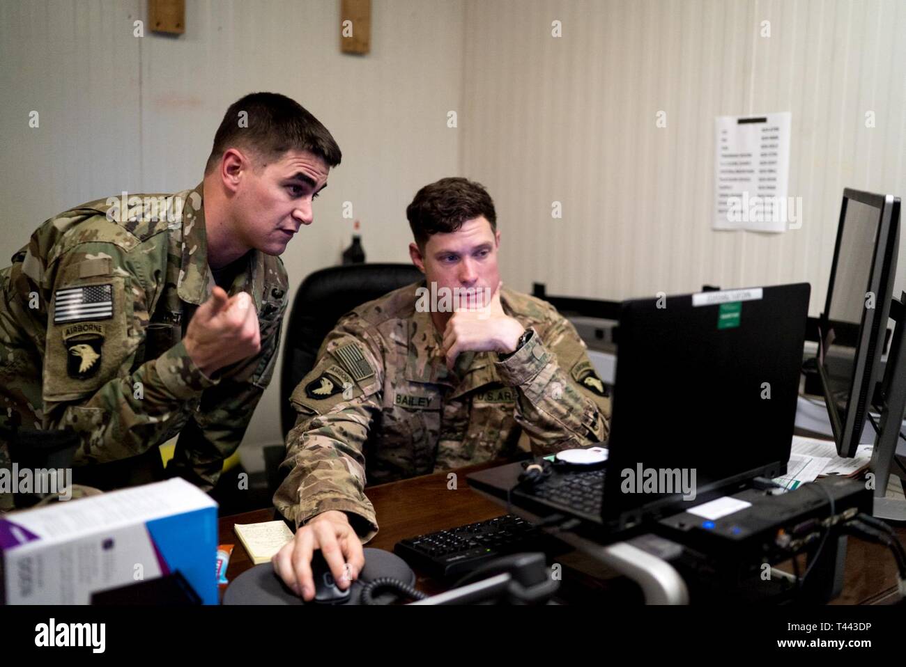 U.S. Army Capt. Connor McCarthy, left, and Cpl. Aaron Bailey, right ...