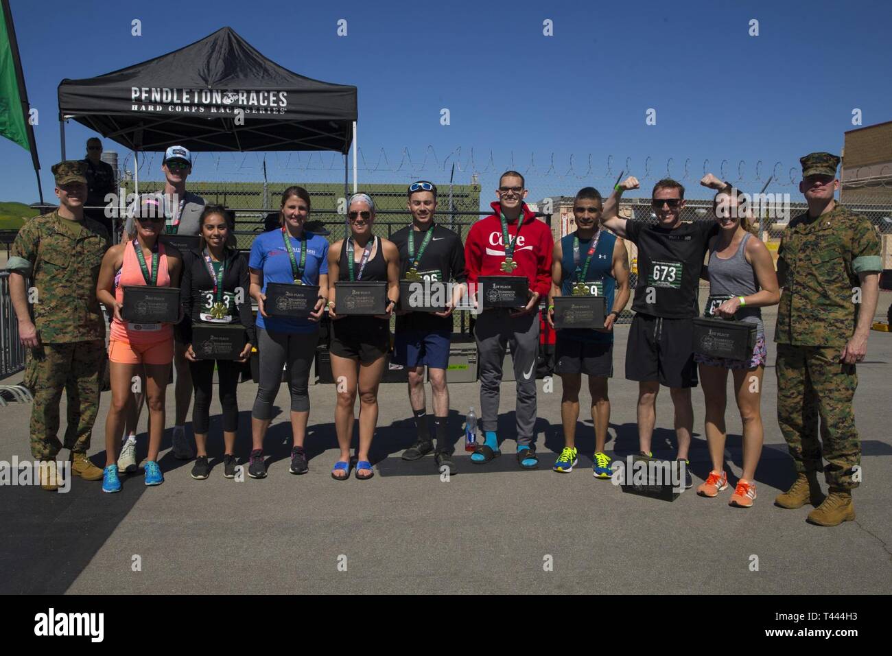 The top overall winners of the Shamrock Stampede 10k and 5k pose for a ...