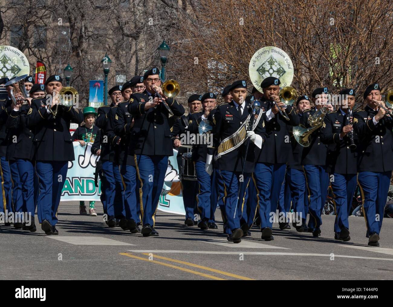 Soldiers assigned to the 4th Infantry Division Band march in the 35th ...