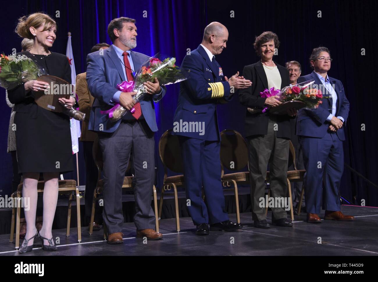 Elizabeth "Betty" Uhrig, second from right, is applauded after being ...