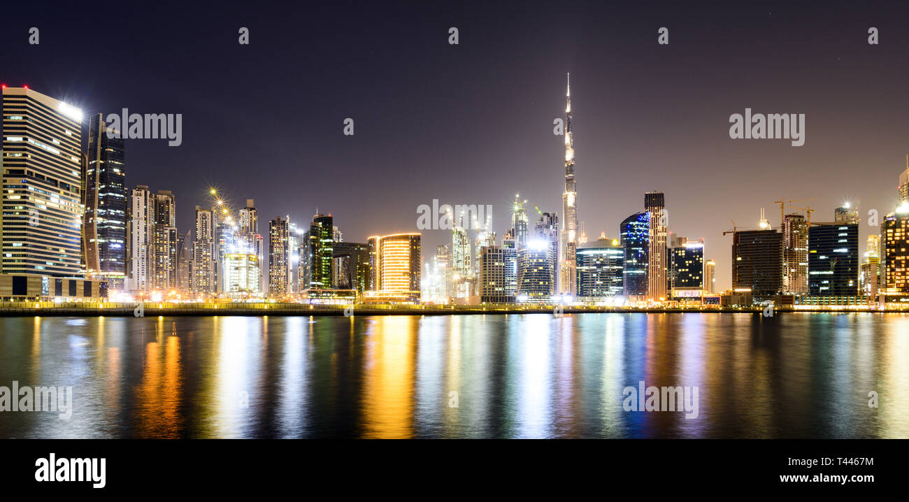 Stunning view of the illuminated Dubai skyline during sunset with the ...