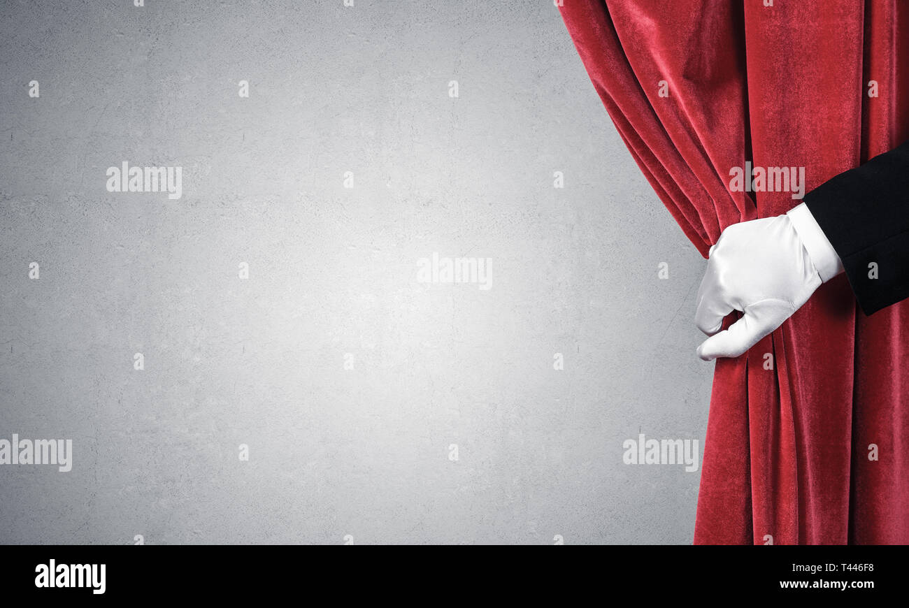 Close up of hand in white glove open red velvet curtain Stock Photo - Alamy