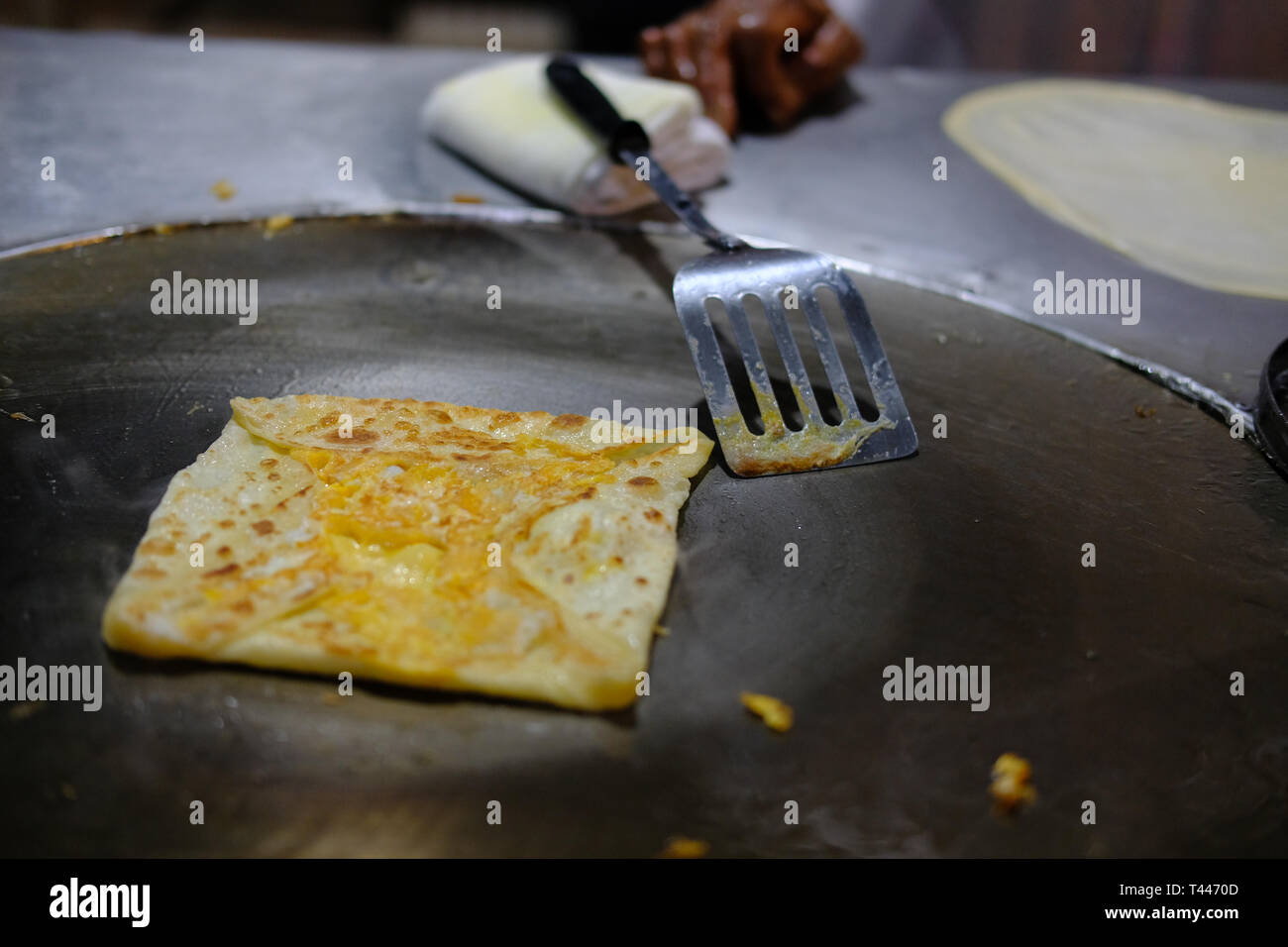 frying roti on hot pan. traditional street food in Thailand Stock Photo ...