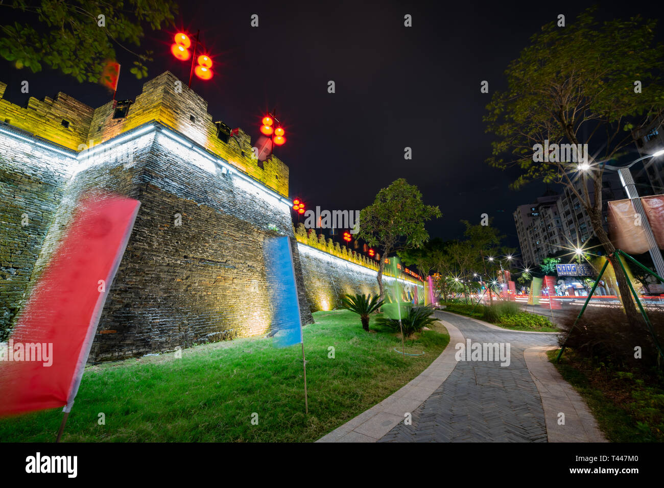 Night view of the Zhaoqing Ancient City Wall with Pi Yun Lou building ...