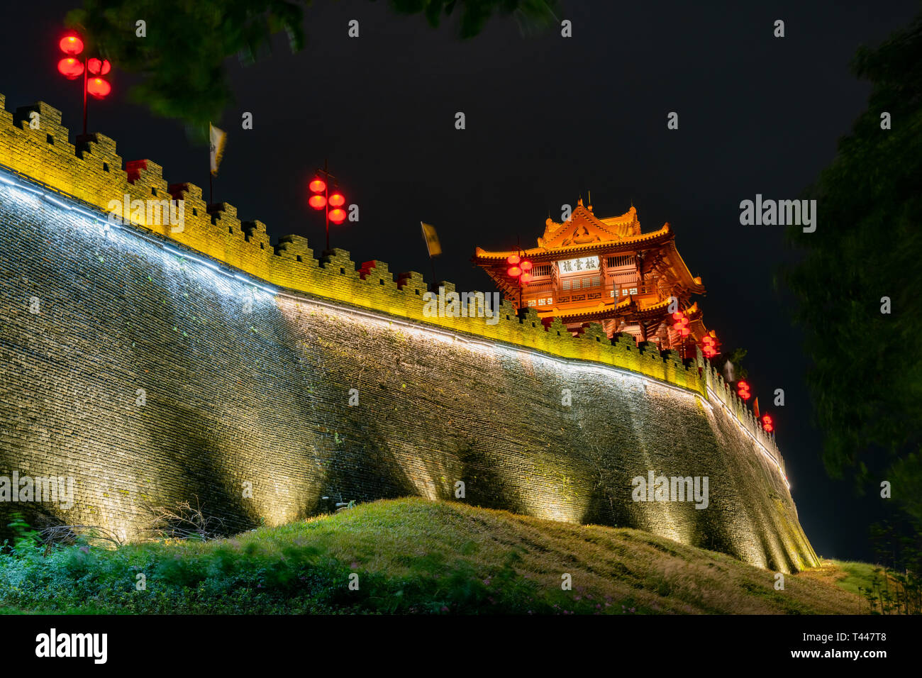 Night view of the Zhaoqing Ancient City Wall with Pi Yun Lou building ...