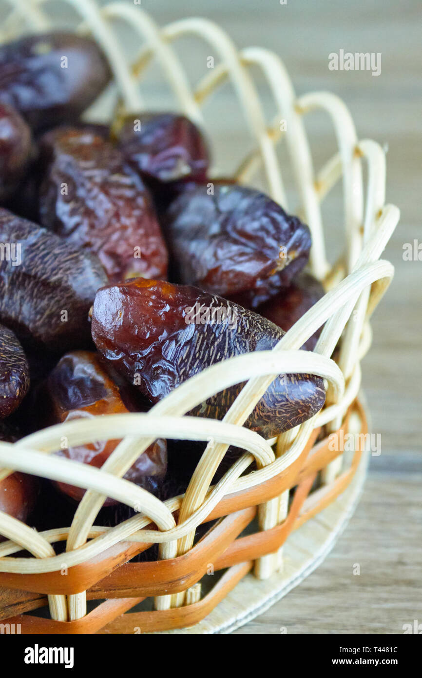 sweet algerian arabic dates fruits on wooden basket Stock Photo - Alamy