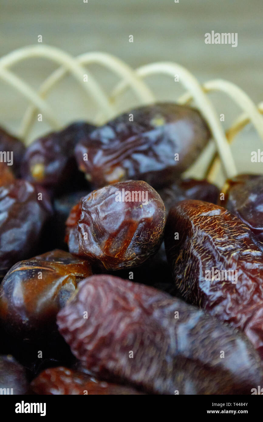 sweet algerian arabic dates fruits on wooden basket Stock Photo - Alamy