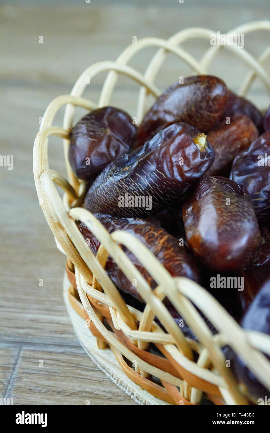 sweet algerian arabic dates fruits on wooden basket Stock Photo - Alamy