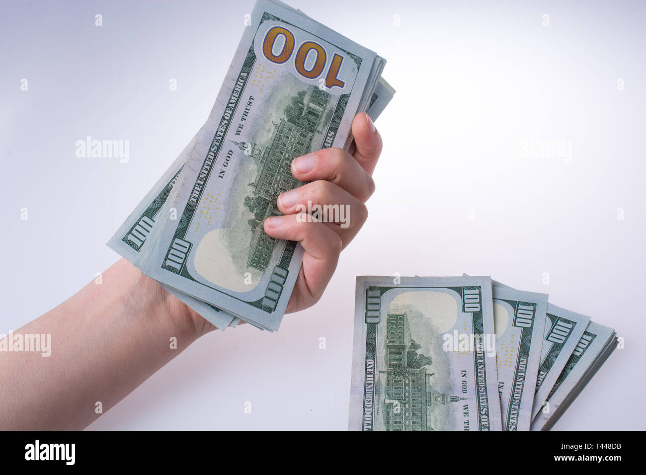 Human hand holding American dollar bill as money isolated on white ...