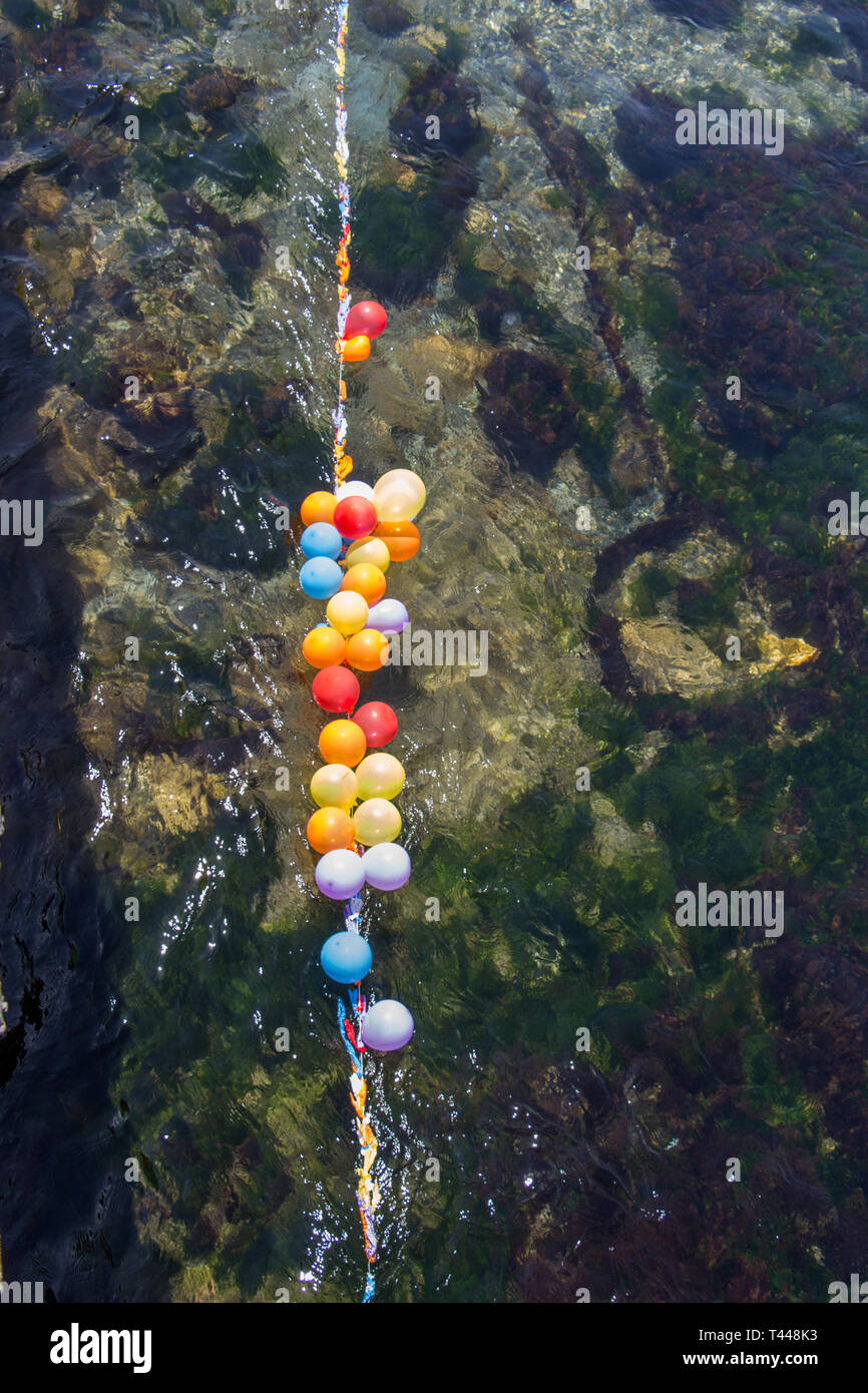 Balloons in shooting range as targets on water Stock Photo - Alamy