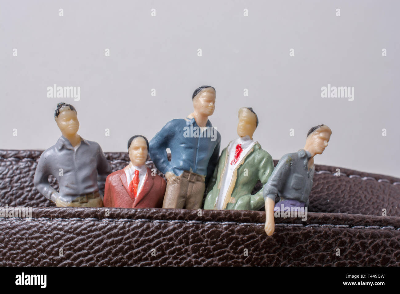 Tiny figurine of group of men miniature model in pockets Stock Photo ...