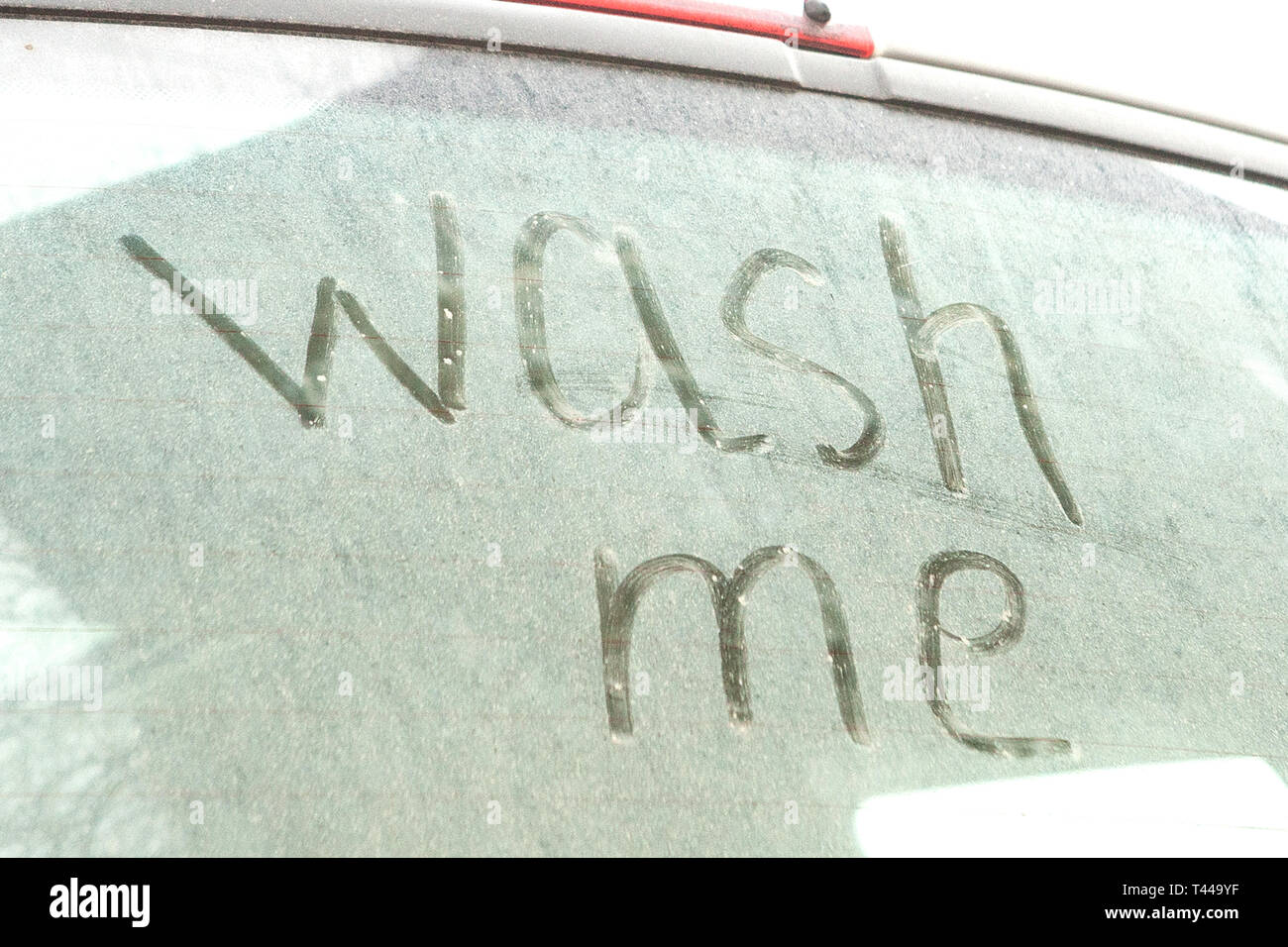 Write the words wash me on the very dirty surface of the car. Concept ...