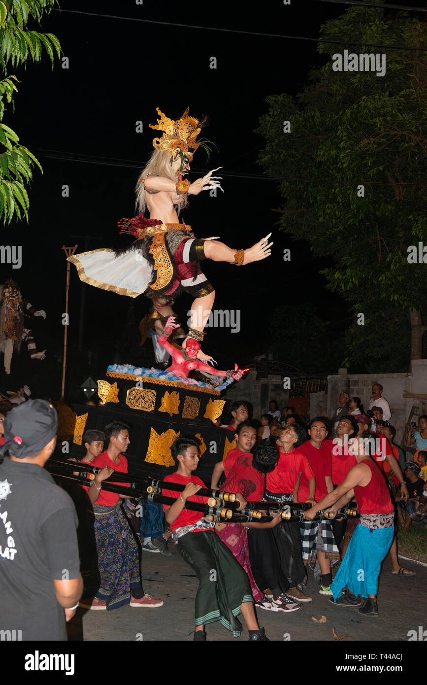 Villagers carrying Ogoh-ogoh, mythological demon, paper-mache statues ...