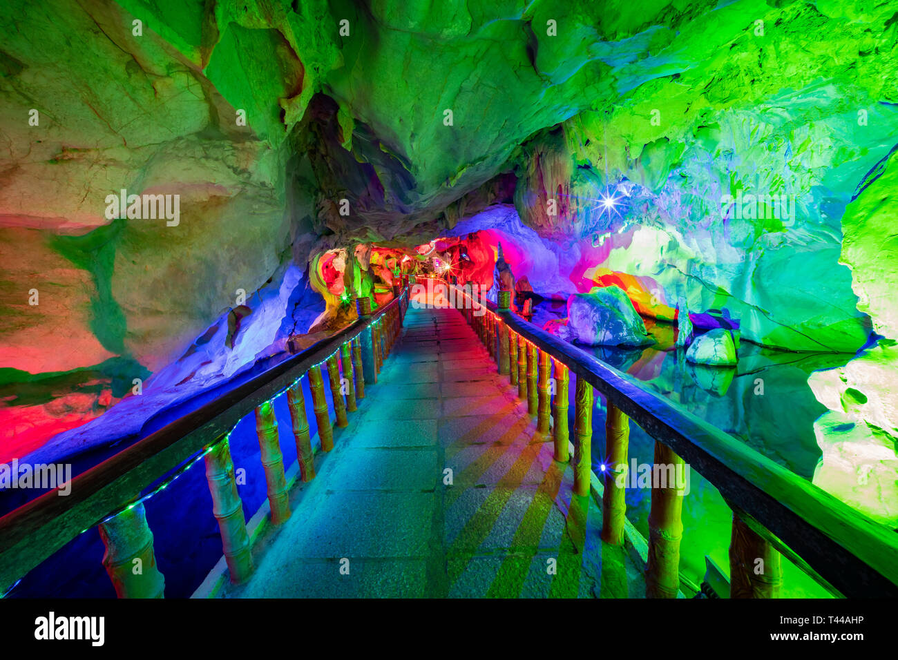 The beautiful Seven Star cave with colorful lights and reflection at ...