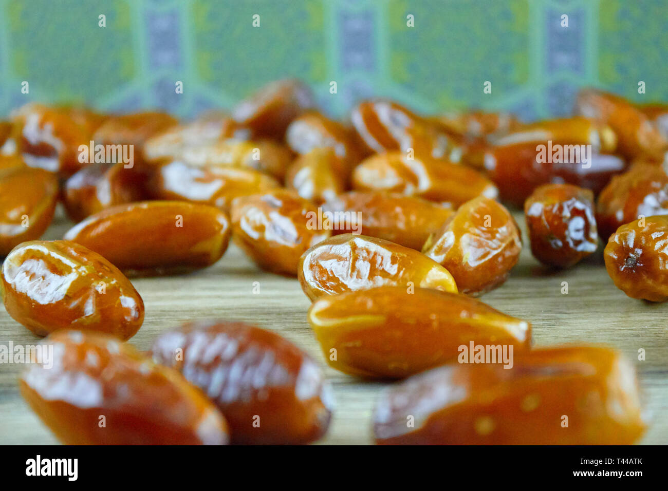 Sweet arabic algerian dates fruits on a wooden floor Stock Photo - Alamy