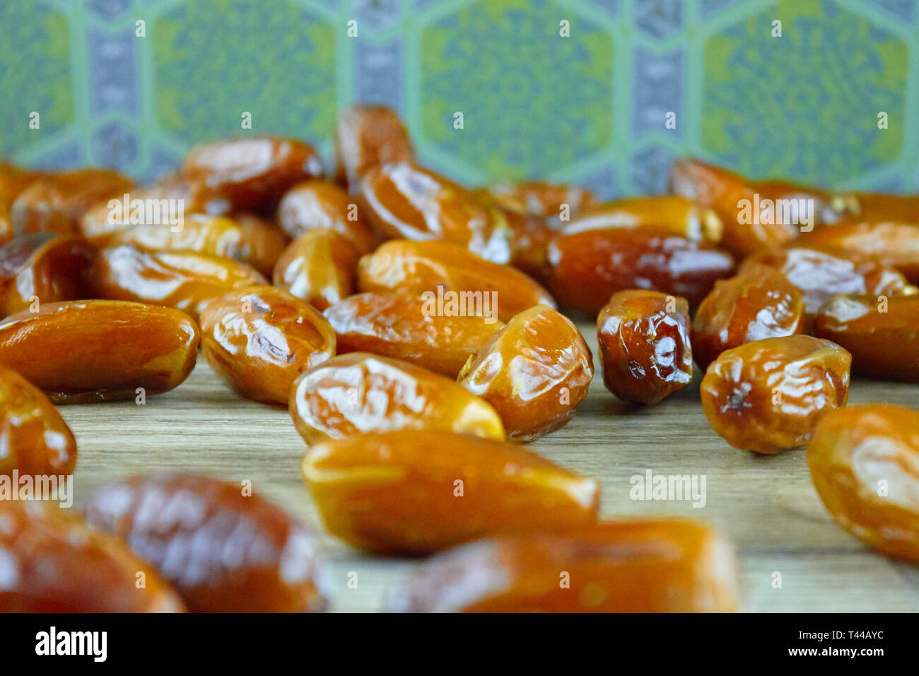 Sweet arabic algerian dates fruits on a wooden floor Stock Photo - Alamy