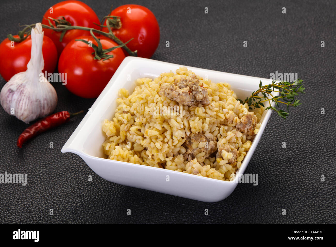 Bulgur with meat and spices Stock Photo - Alamy