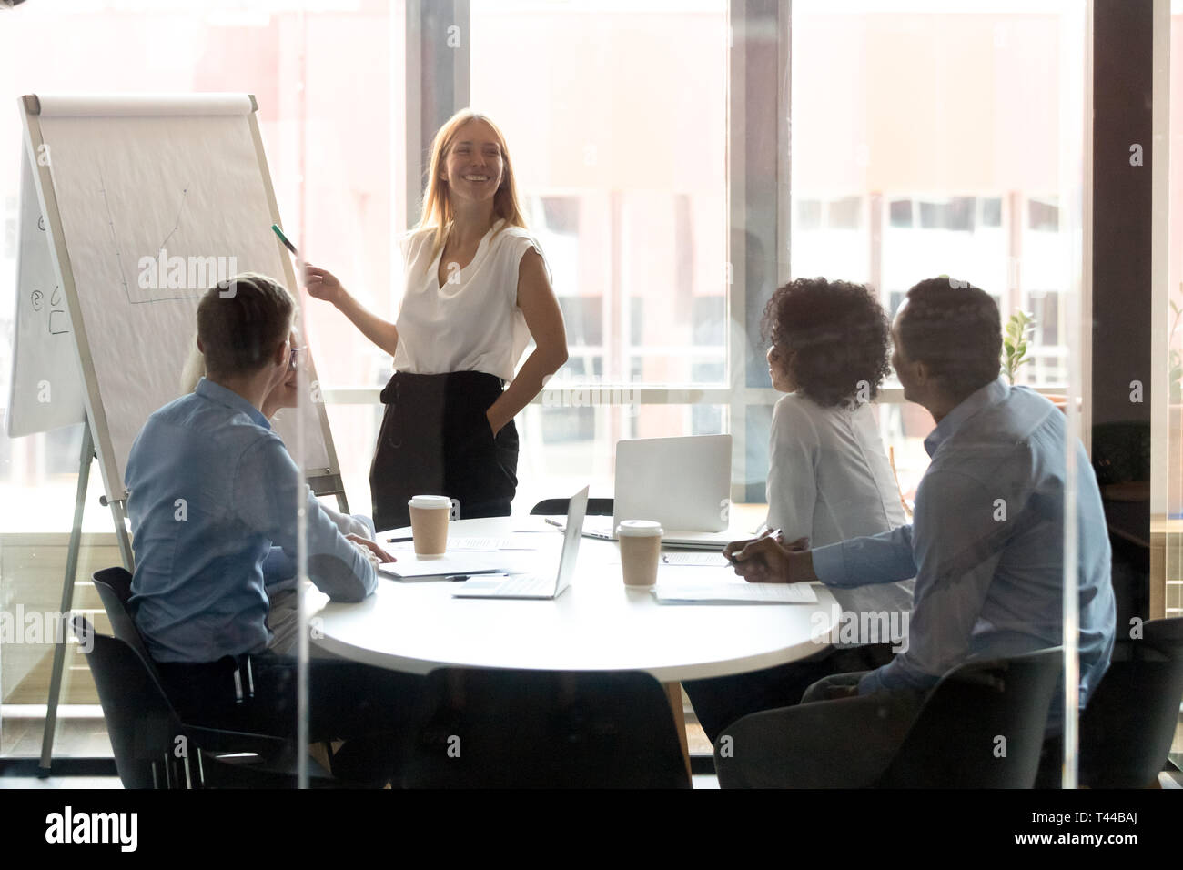 Woman presenting speaking colleagues hi-res stock photography and ...