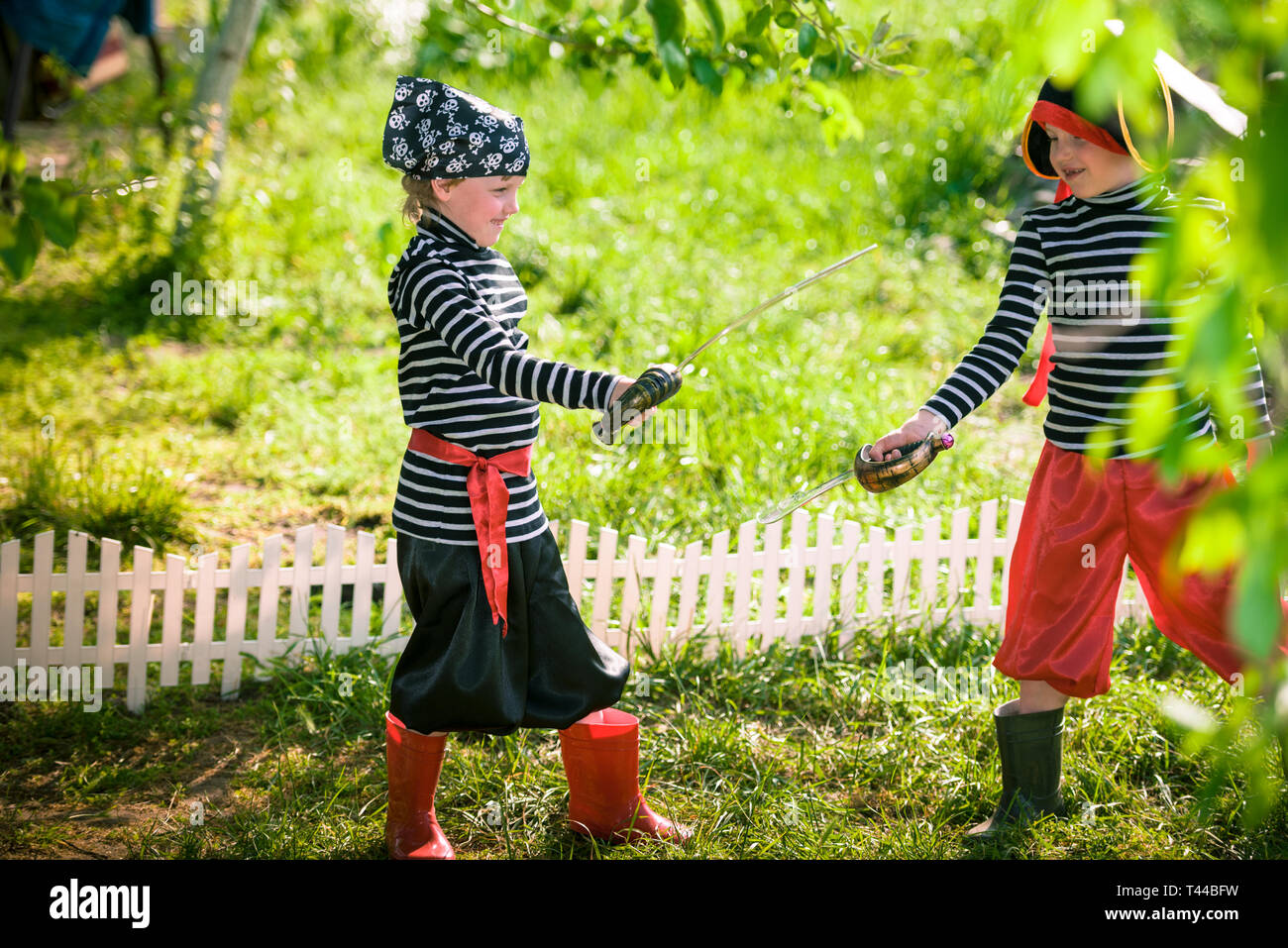 children play pirates at backyard Stock Photo - Alamy