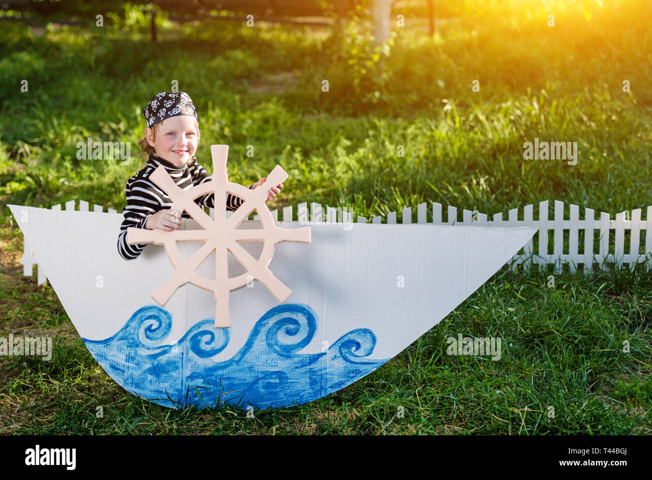 kid plays pirate at backyard Stock Photo - Alamy