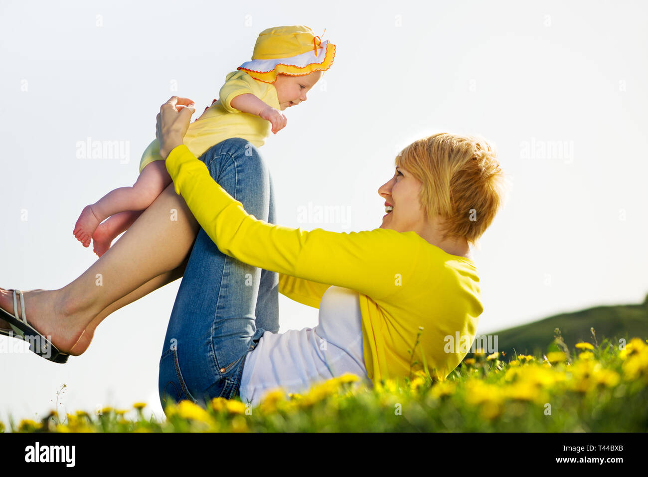 Happy mother playing baby outdoor hi-res stock photography and images - Alamy