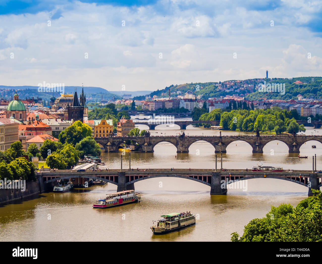 Cityscape of Prague with Vltava river through the trees of Vrtba ...