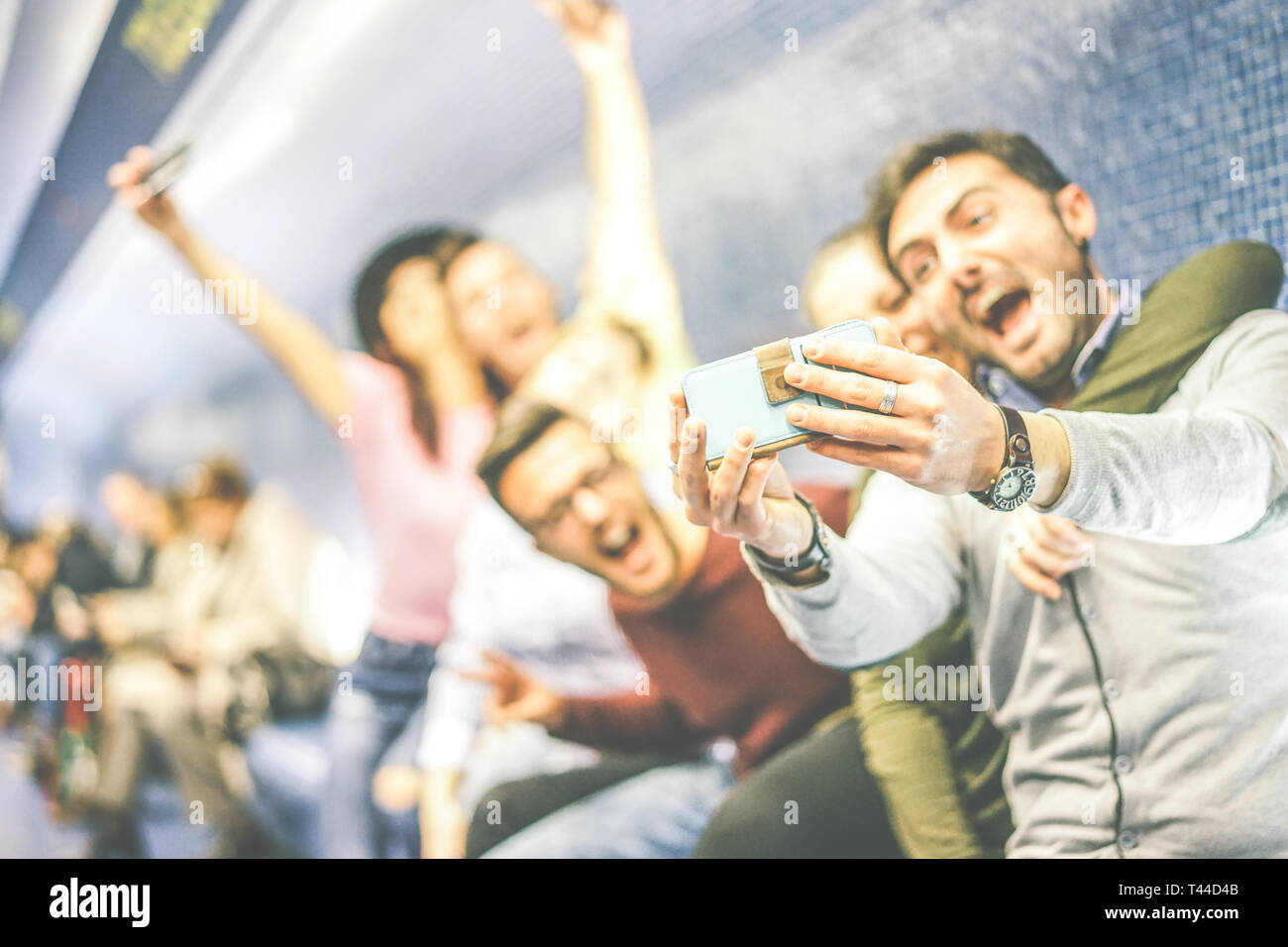 Happy Friends Taking A Photo Selfie Using Mobile Smart Phone Camera