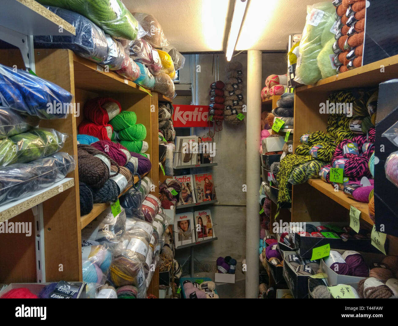 Messy racks filled with knitting wool and yard in the basement of a ...