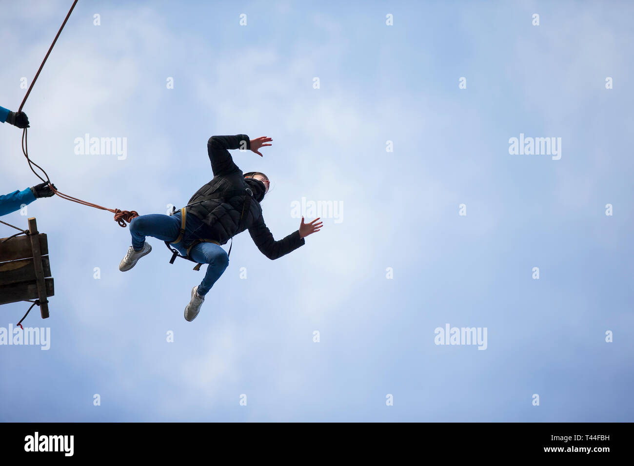 Belarus, Gomel, March 08, 2019. Jumping from the bridge to the rope ...