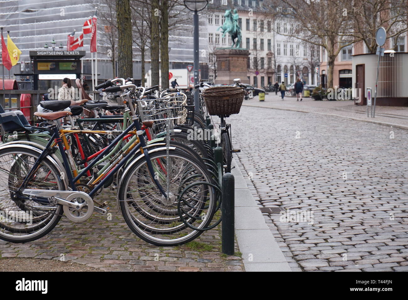 Bikes parked in the street with the statue of city founder Absalon ...