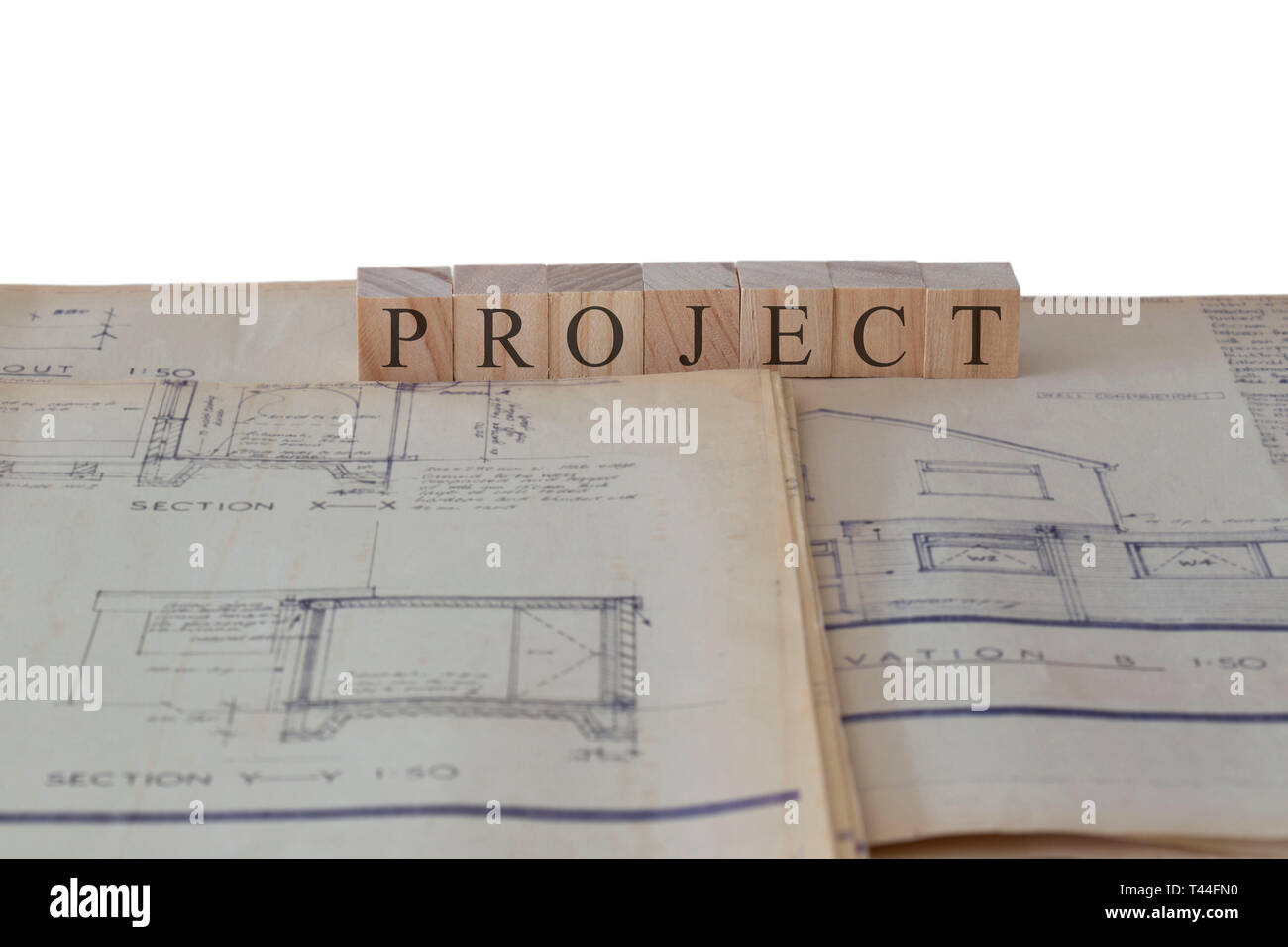 Project written on wooden blocks on house extension building plans ...