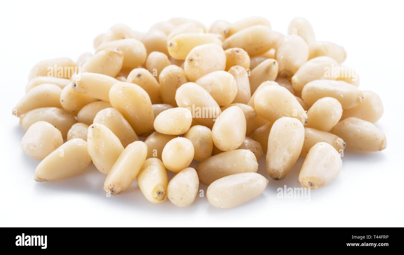 Pine nuts on the white background. Organic food Stock Photo - Alamy