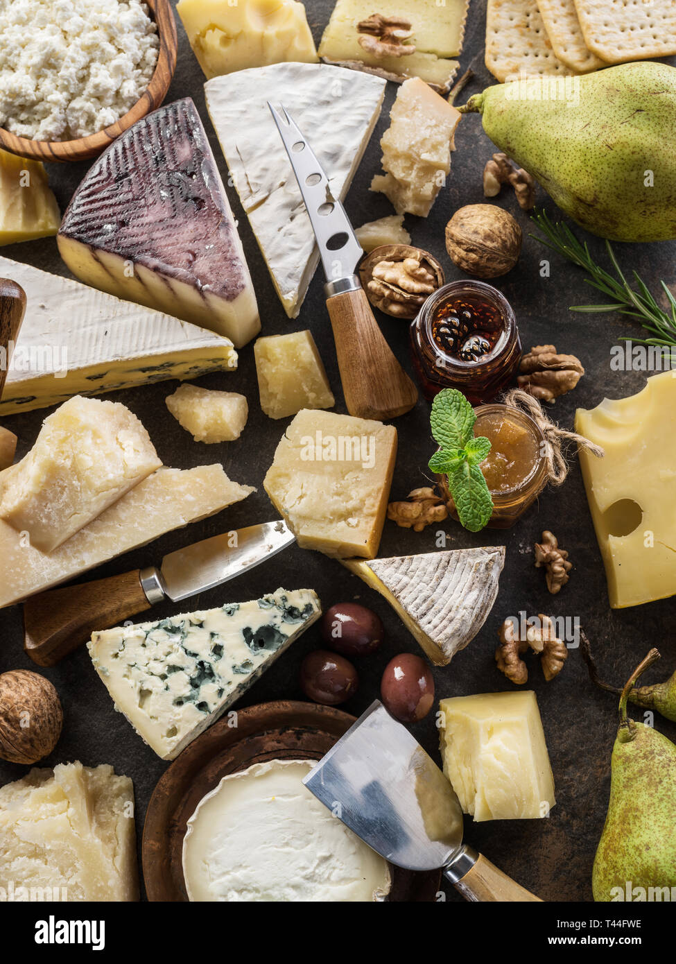 Assortment of different cheese types on stone background. Top view ...
