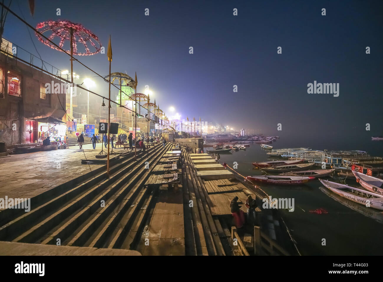 Varanasi Ganges river ghat at night with ancient architecture and ...