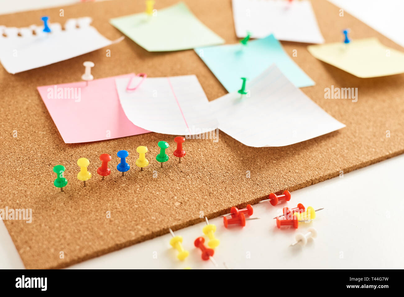 Cork board with pinned colored blank notes Stock Photo - Alamy