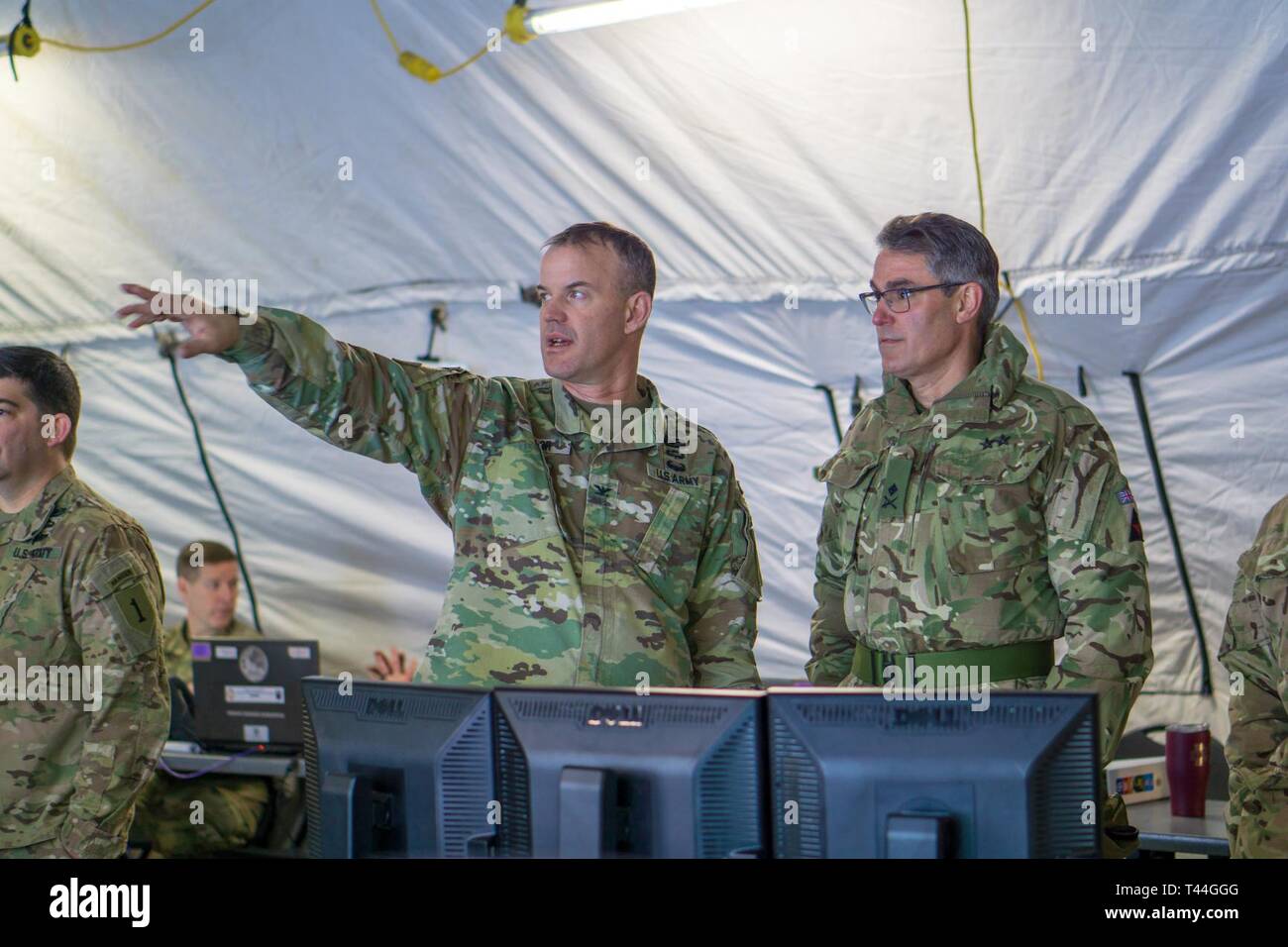 Col. Curtis Taylor, 1st Infantry Division chief of staff, briefs Maj ...