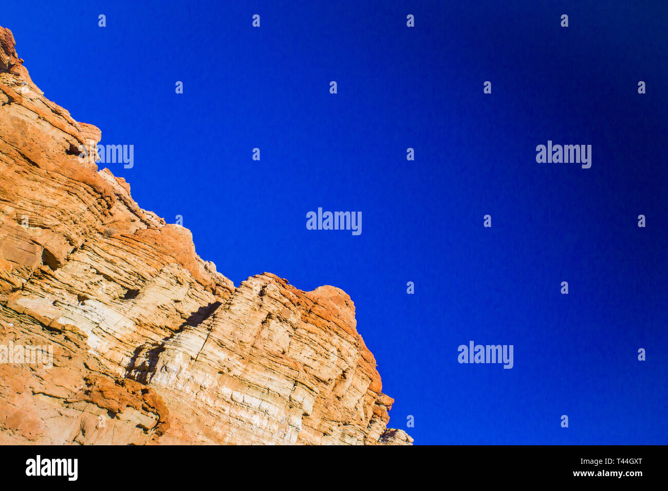 Towering walls of a cliff face in Red Rock Canyon State park in ...