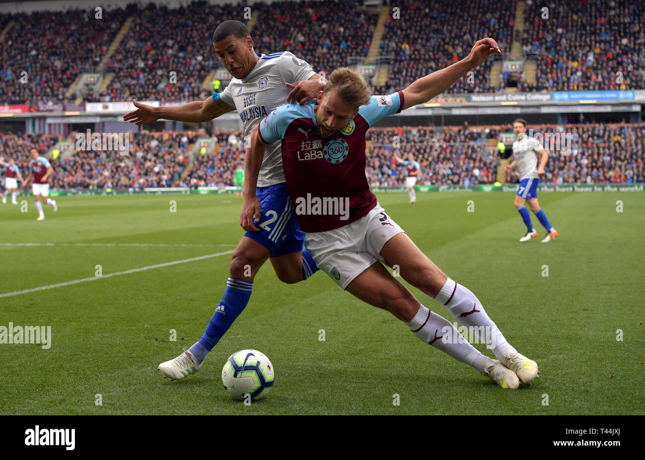 Cardiff City's Lee Peltier (left) and Burnley's Charlie Taylor battle ...